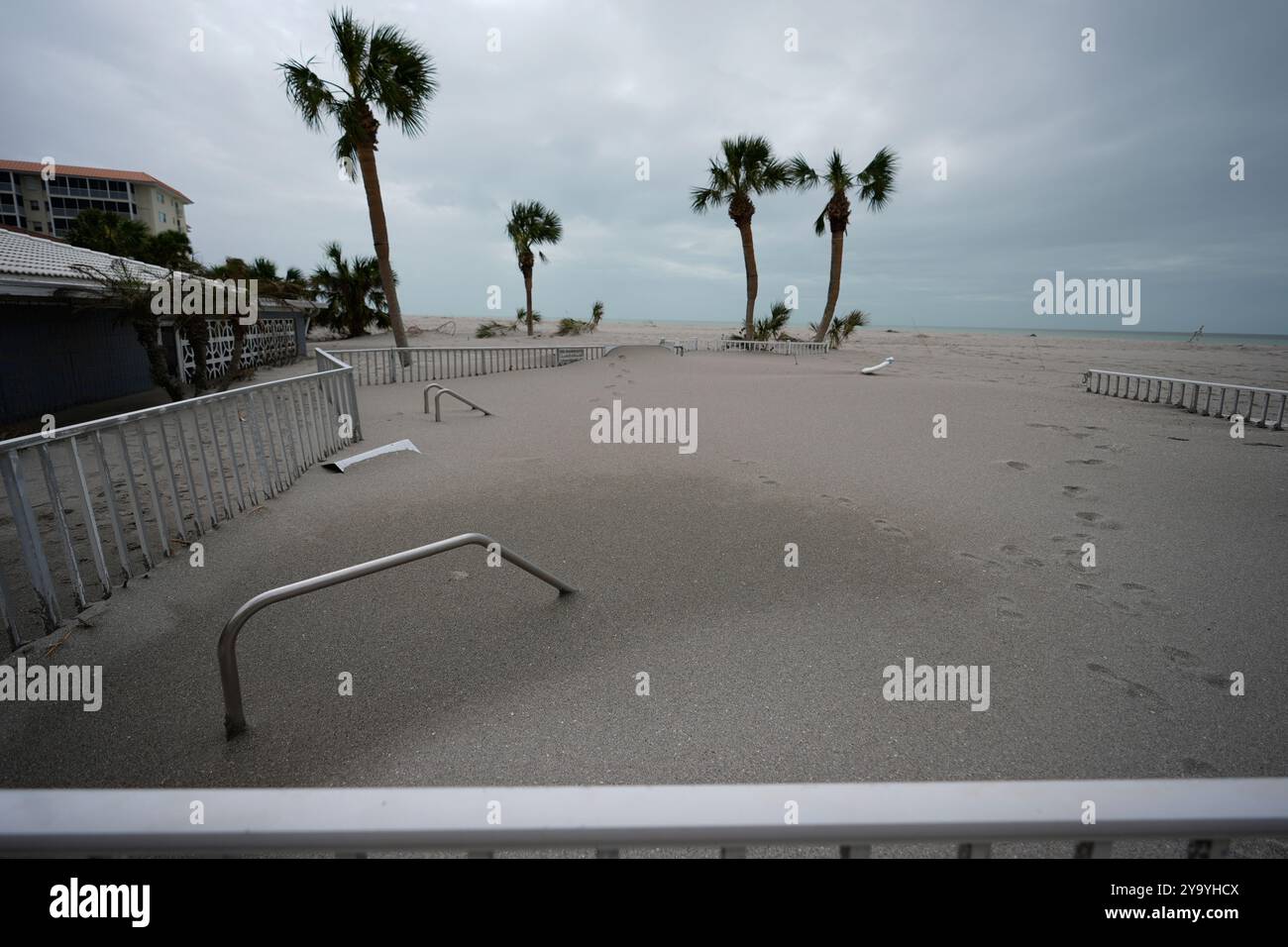 Only handrails are visible after a beachfront swimming pool was ...