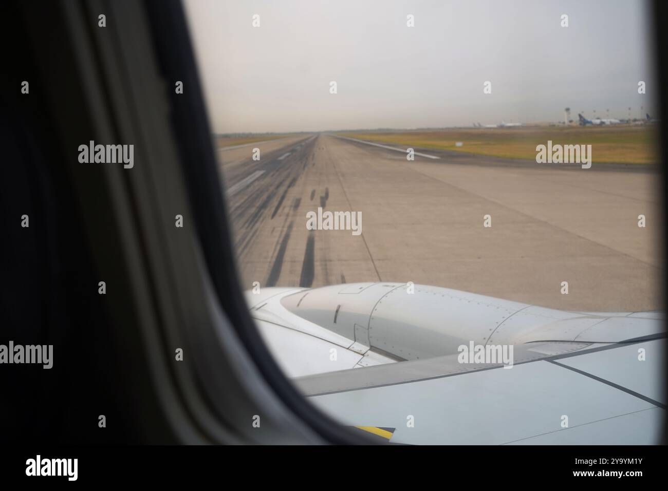 View of airplane runway through the window Stock Photo - Alamy