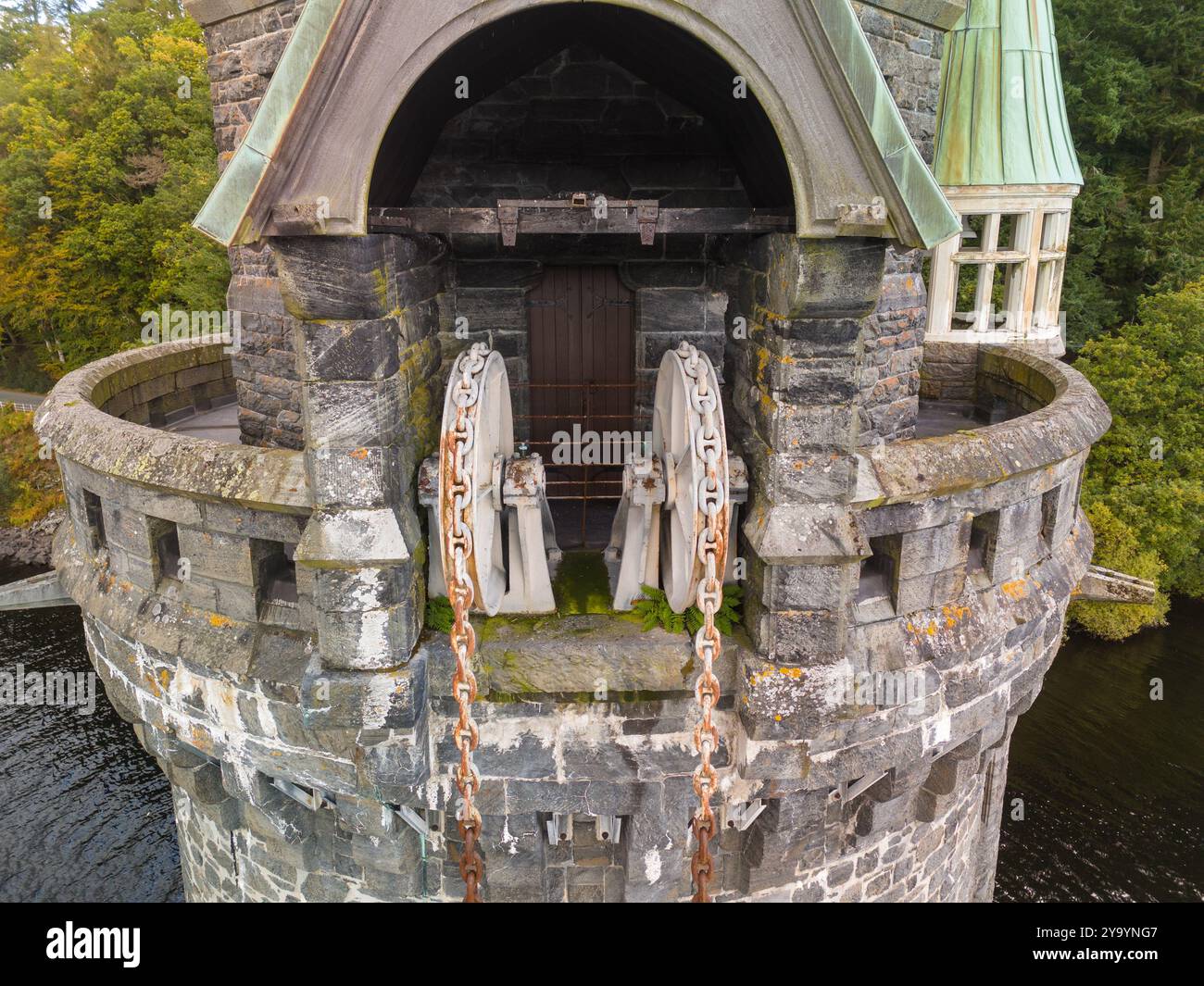 Aerial view of the top of an old stone tower featuring rusty chains and ...