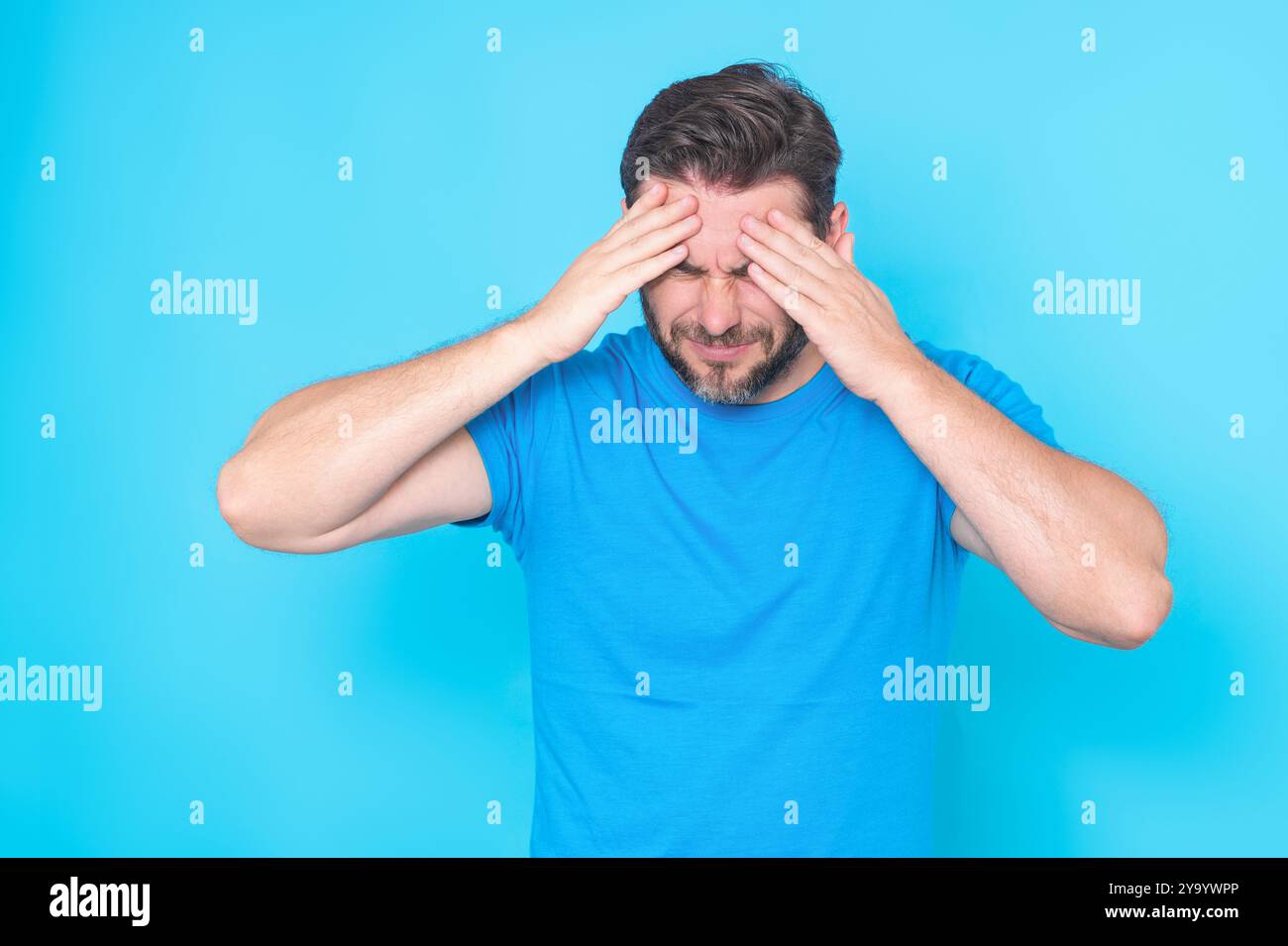 Man suffering from headache. Tired, headache and eye strain. Man with ...