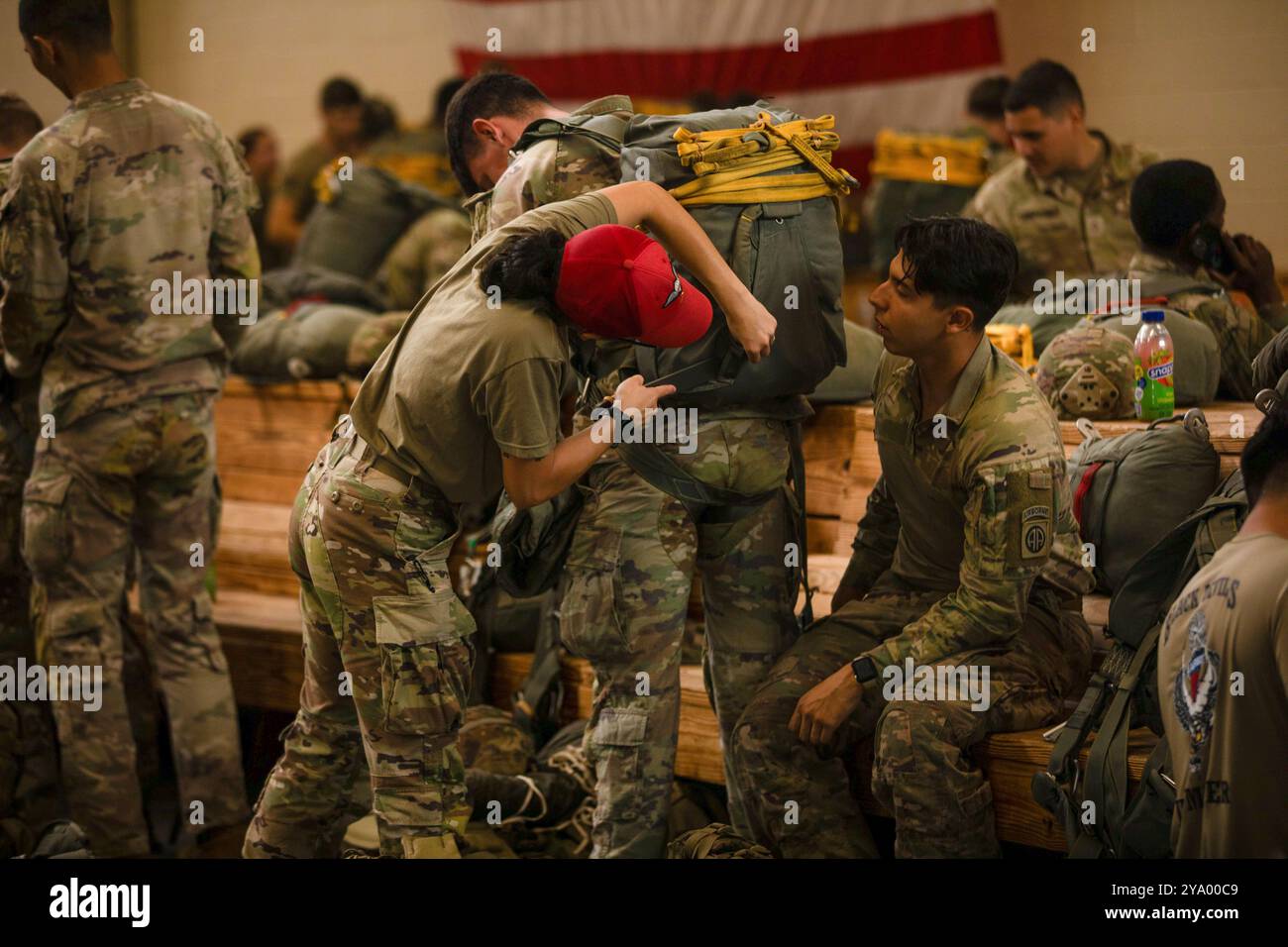A Parachute Rigger assigned to the 82nd Airborne Division checks a ...