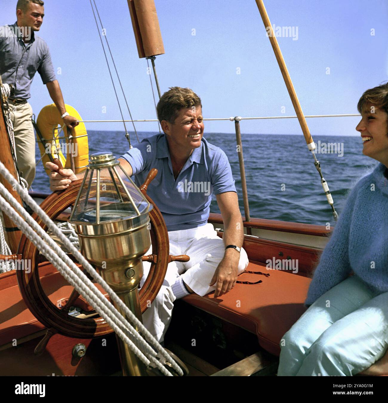 U.S. President John F. Kennedy sitting aboard U.S. Coast Guard boat ...