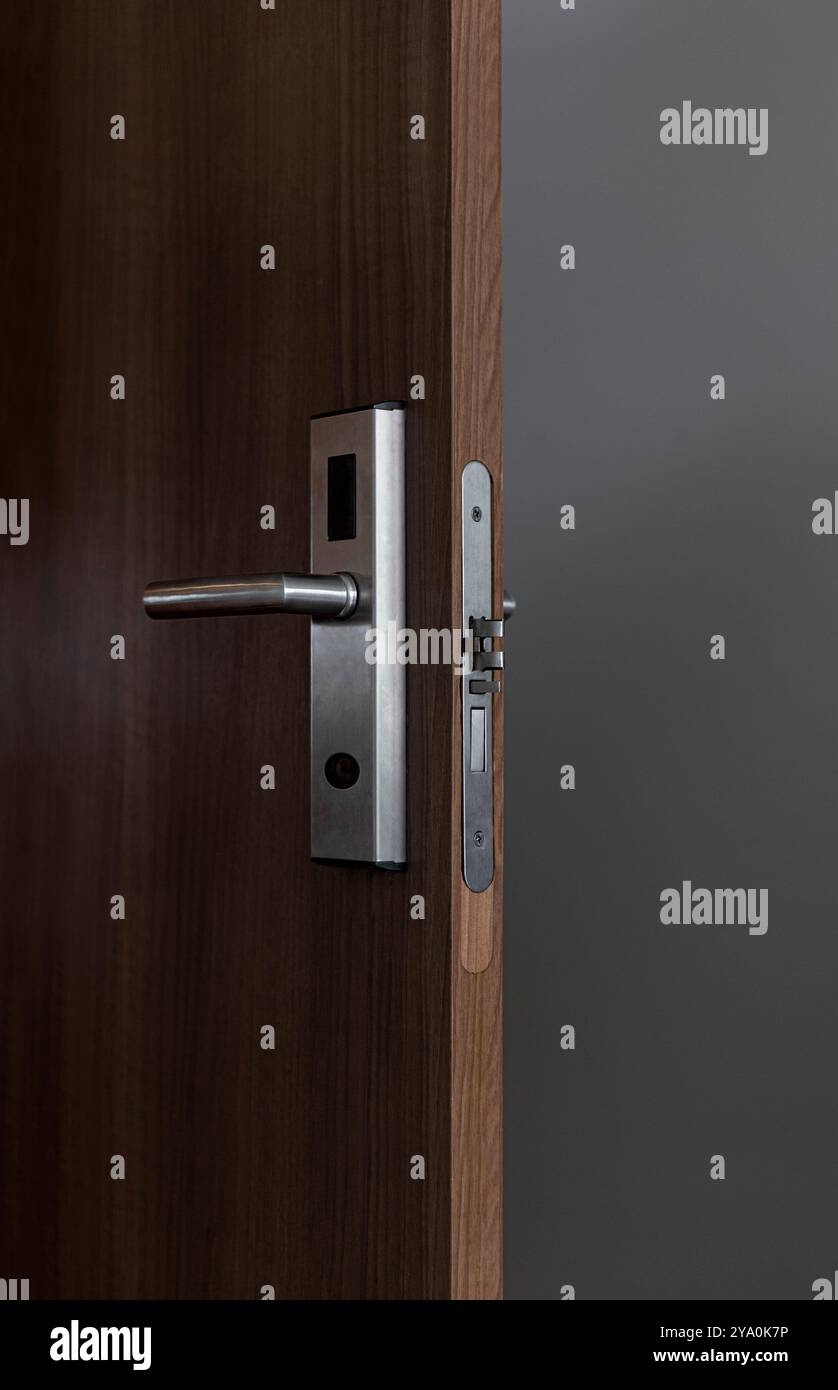 Wooden door with electronic lock. Entrance door with electronic keycard ...