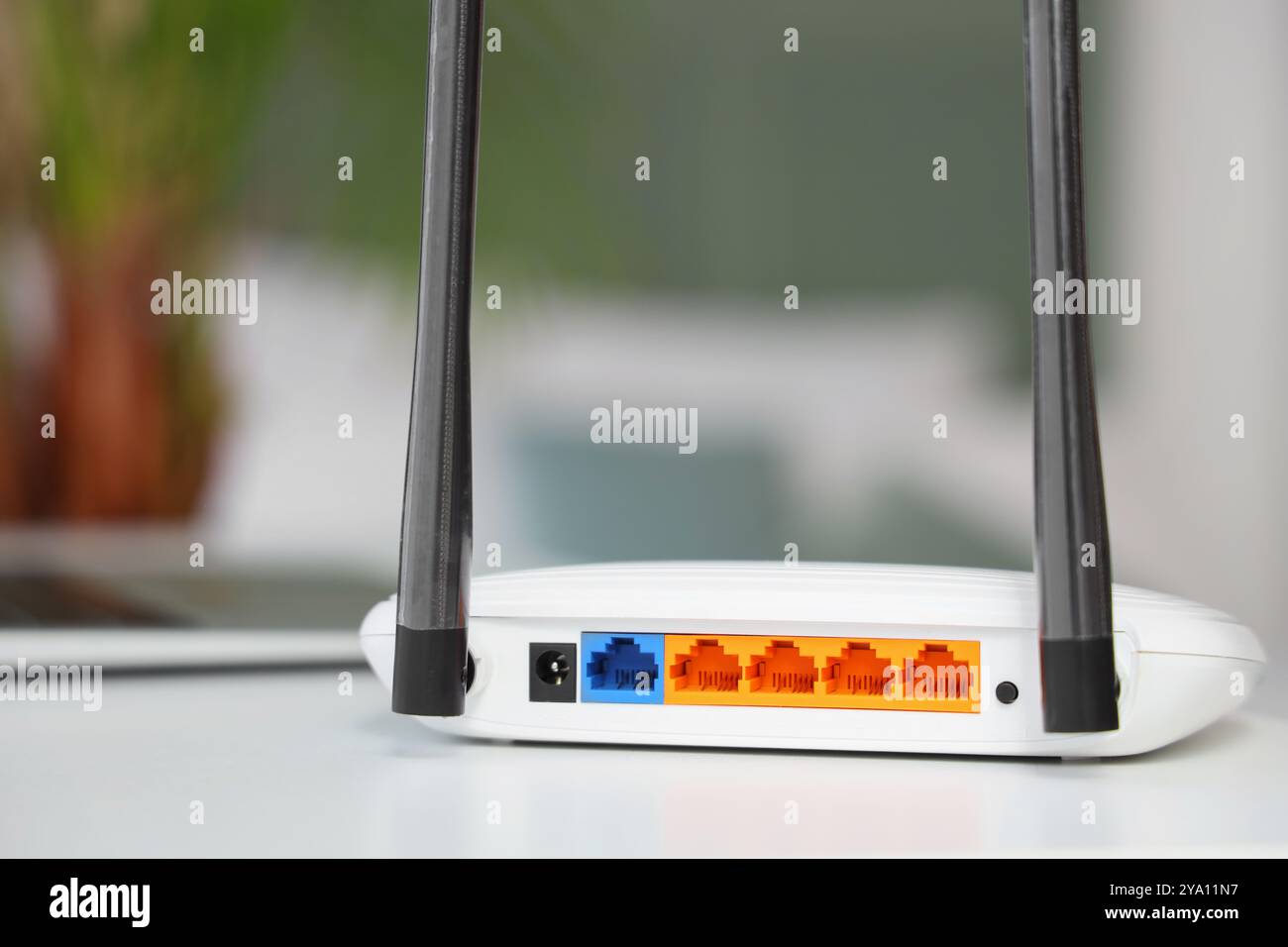 Modern wi-fi router on table in bedroom, closeup Stock Photo - Alamy