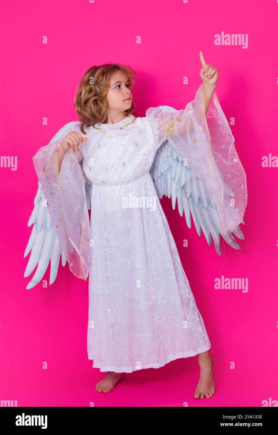 Child angel pointing up, point gesture. Valentines day. Little cupid ...