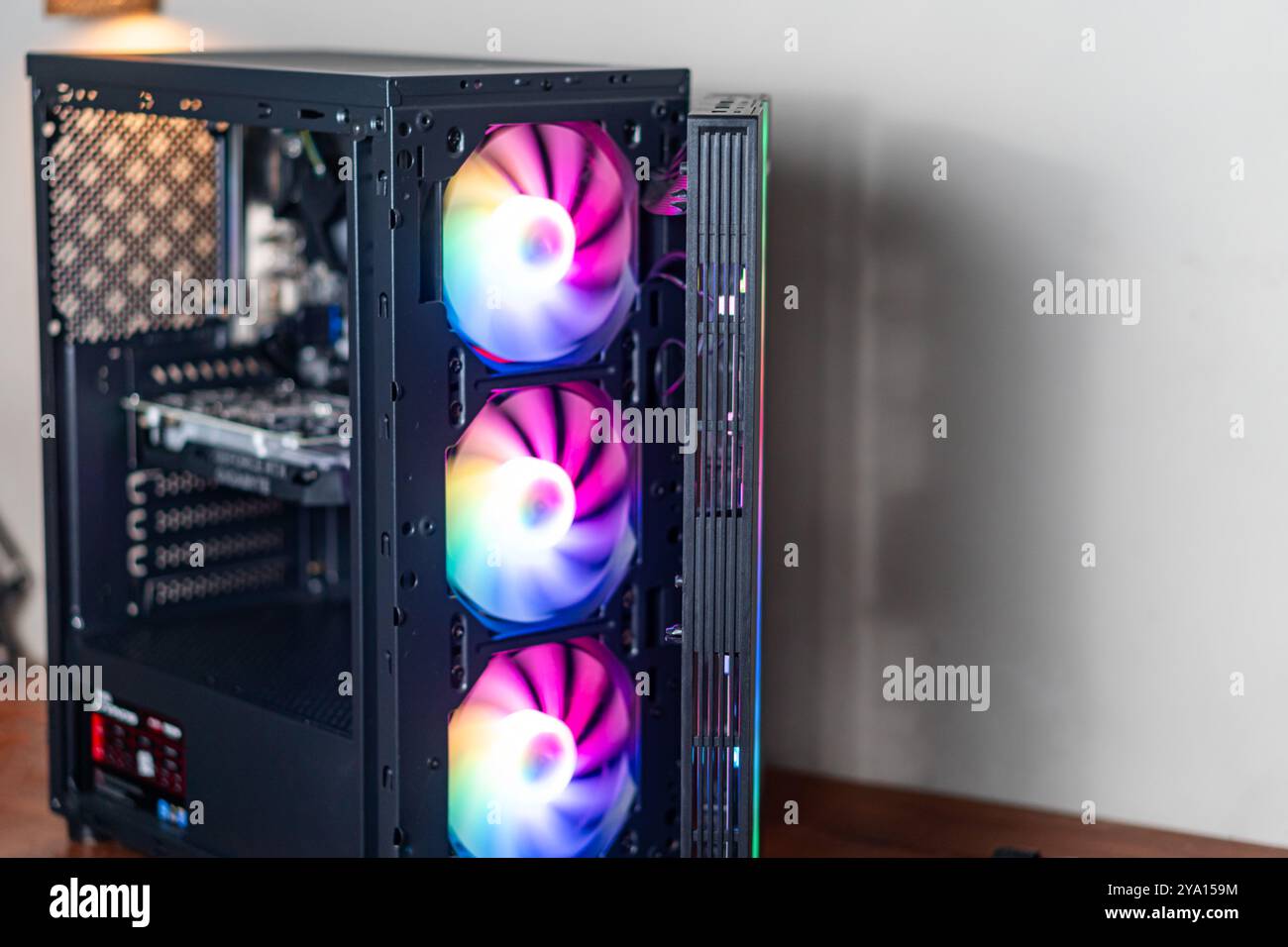 A modern computer case with RGB fans, showcasing a sleek design. The ...