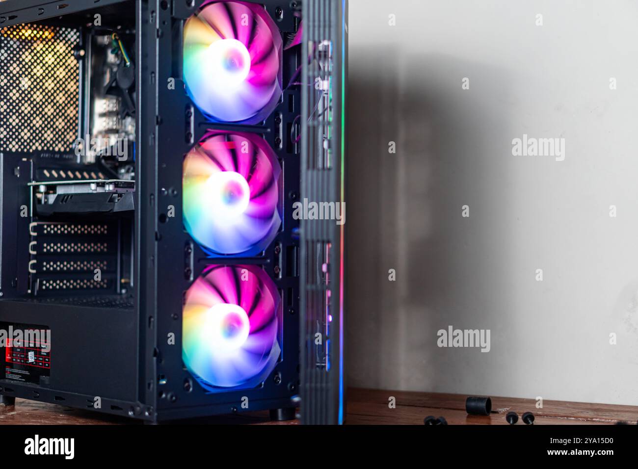 A close-up view of a modern computer case featuring three RGB cooling ...