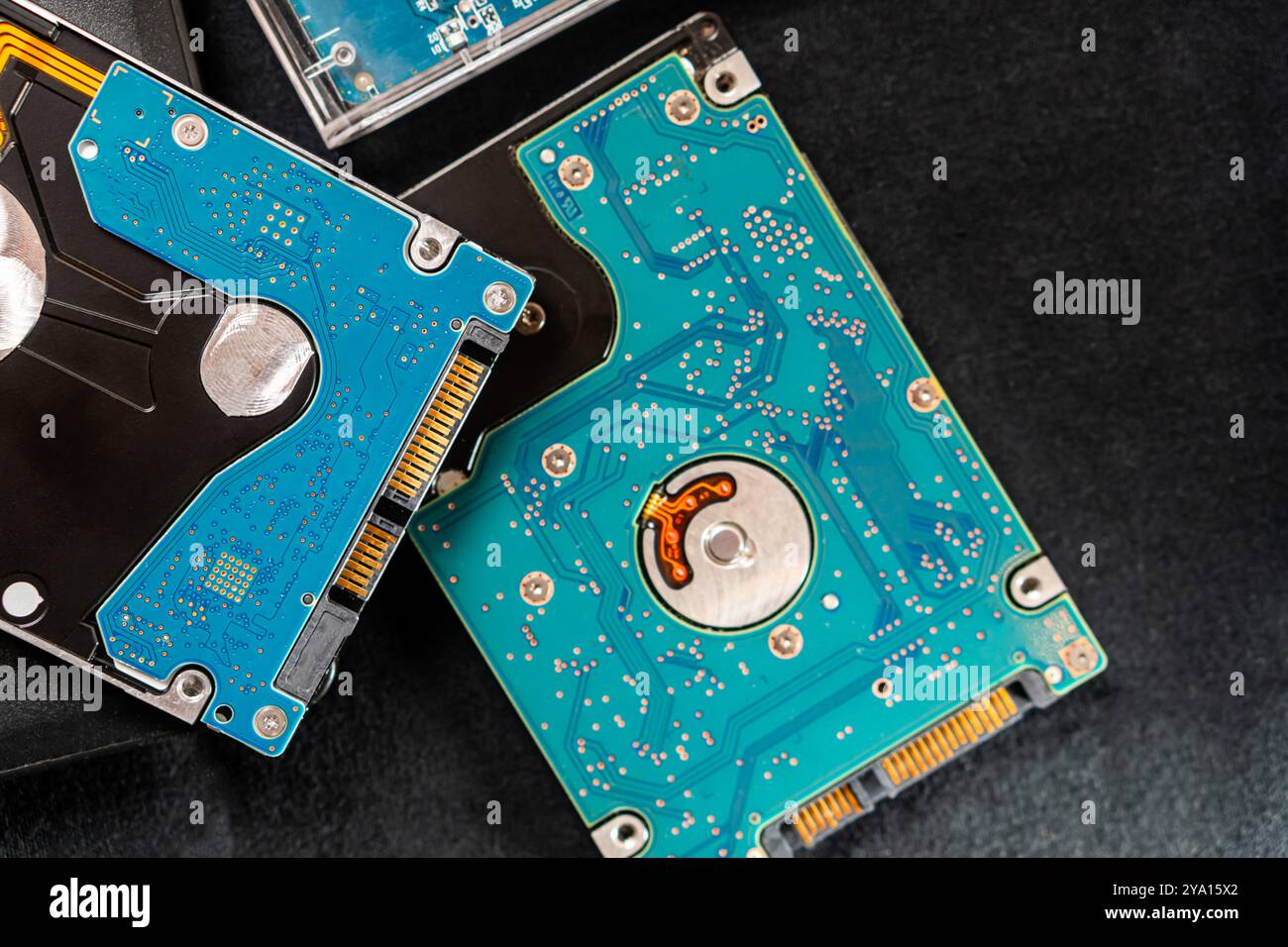 Close-up view of computer hard drives with blue circuit boards ...