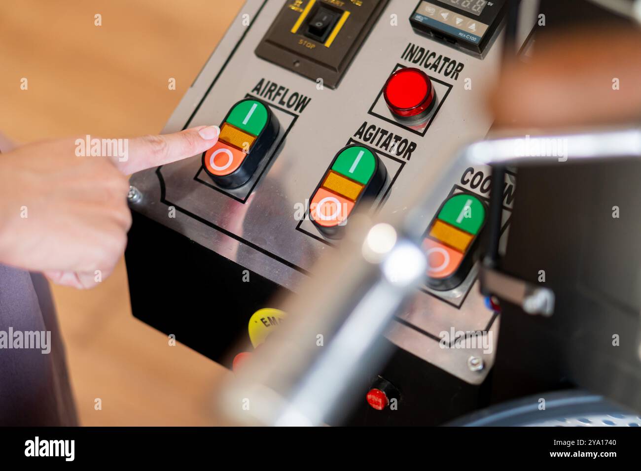 A close-up of a control panel featuring buttons labeled airflow ...