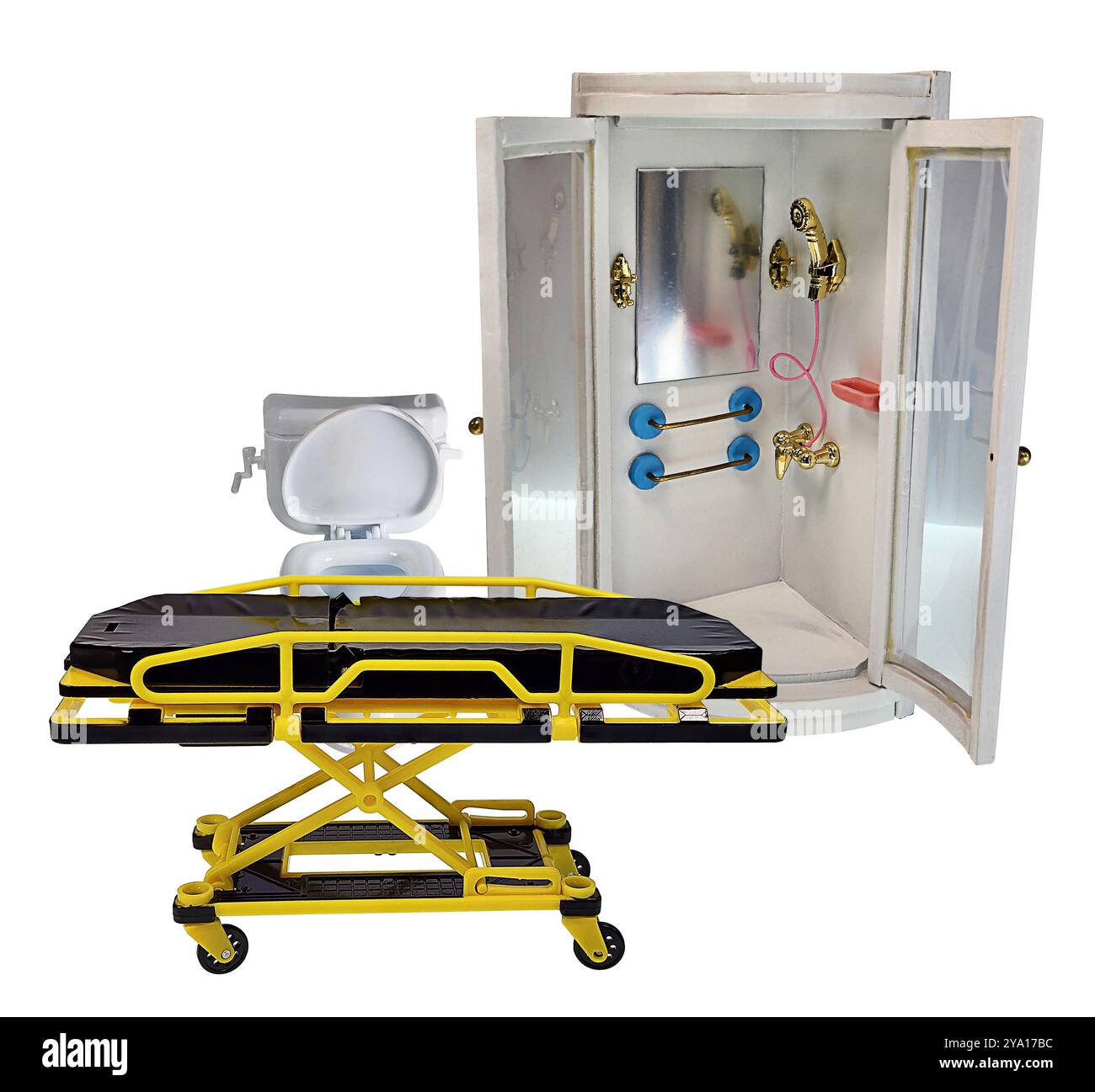 A modern shower stall and toilet with a hospital gurney to show ...