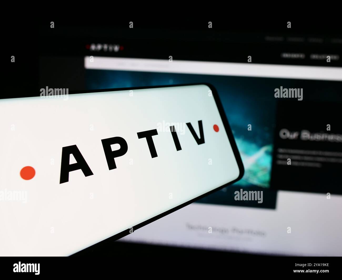 In this photo illustration, a smartphone with the logo of automotive technology company Aptiv ...
