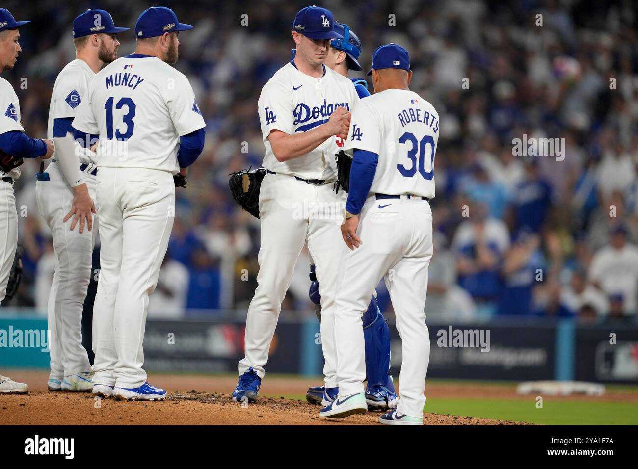 Los Angeles Dodgers relief pitcher Evan Phillips bumps fists with ...