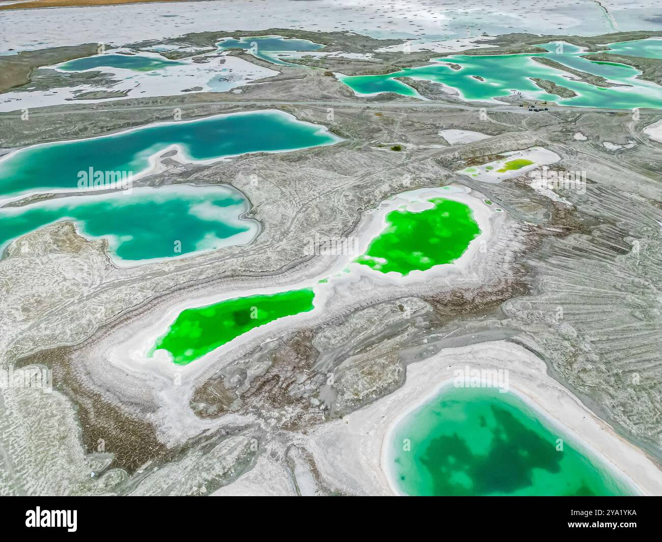 Dachaidan Emerald Lake in Qinghai, colorful salt pools are scattered ...