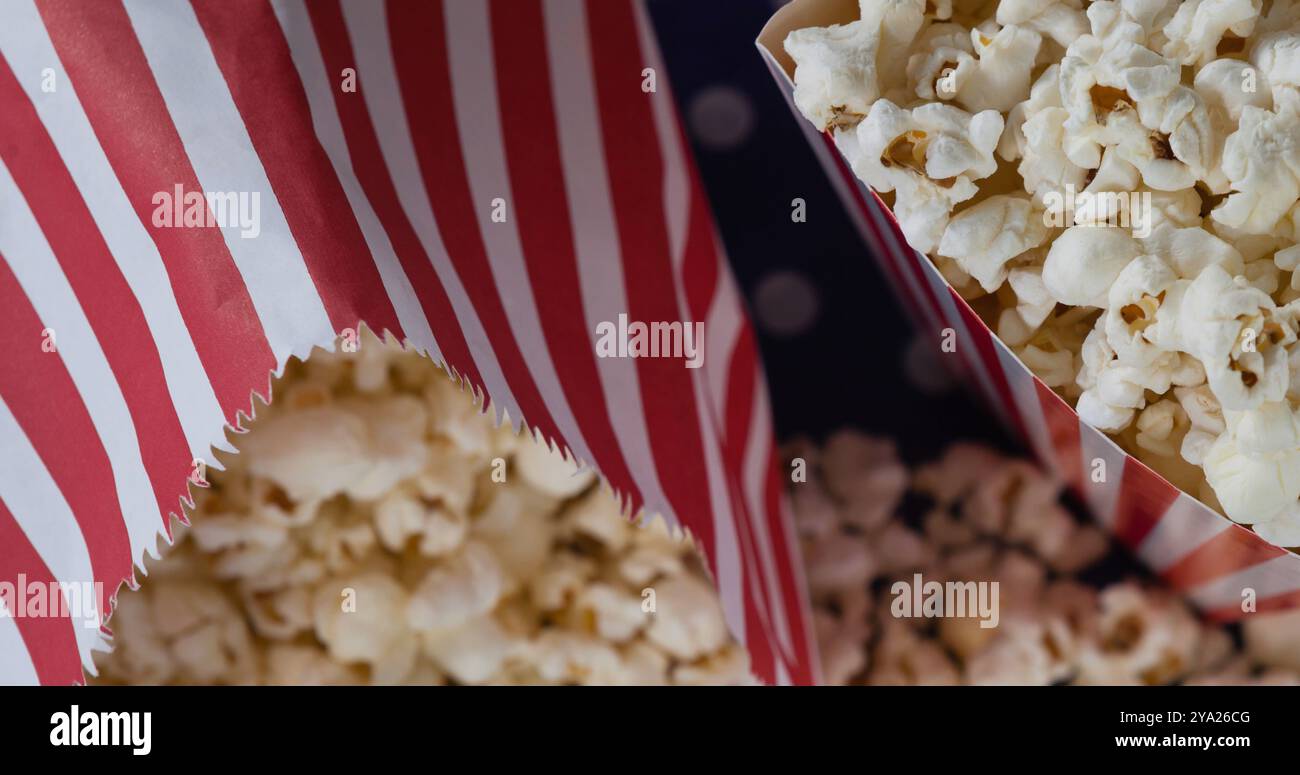 Image of boxes of popcorn over white spots. national popcorn day and ...