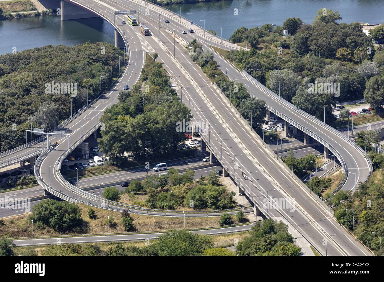 Winding motorway bridges cross a river in an urban area, Vienna Stock ...