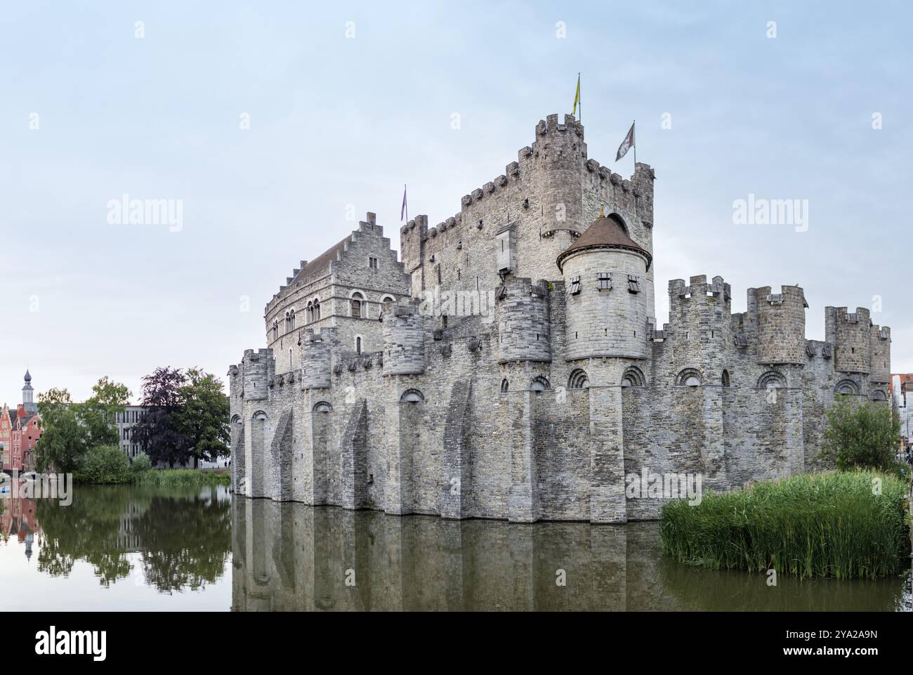 Impressive medieval castle with moat and massive stone walls, Ghent ...