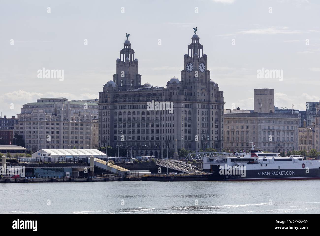 Ferry glides along a murky stretch of water in front of historic ...