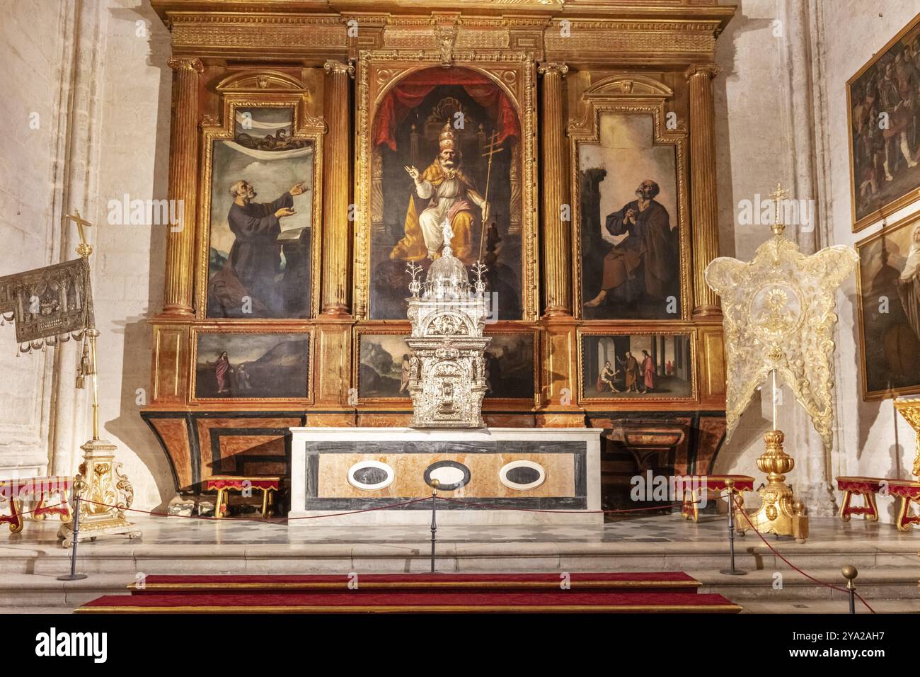 Altar with historical paintings and sacred artworks in a church ...