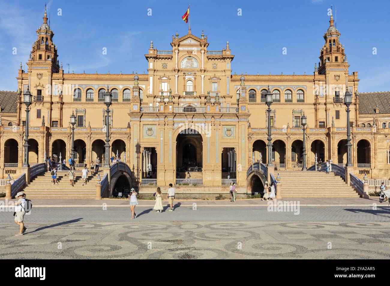 Detail of a historic building with stairs and a Spanish flag on the ...
