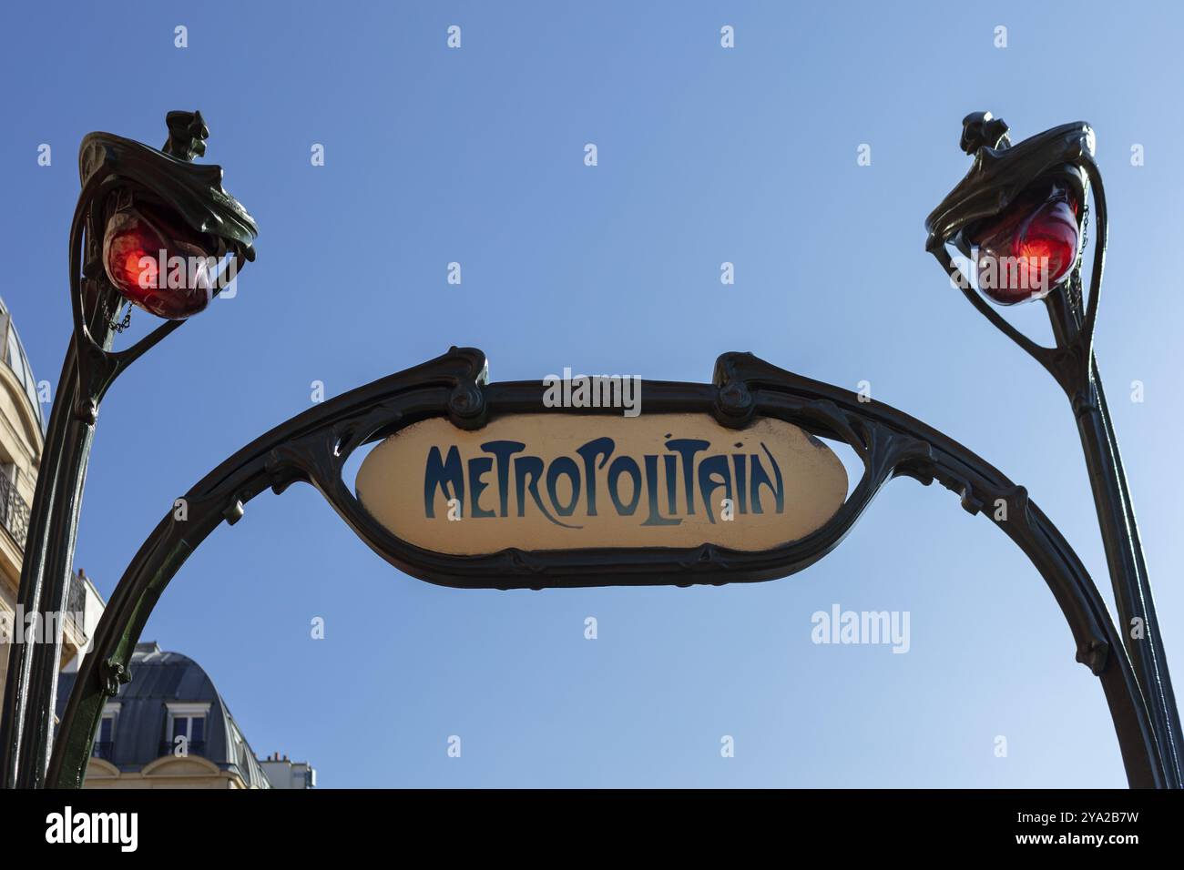 Historic metro sign in Art Nouveau style under a blue sky, Paris Stock ...