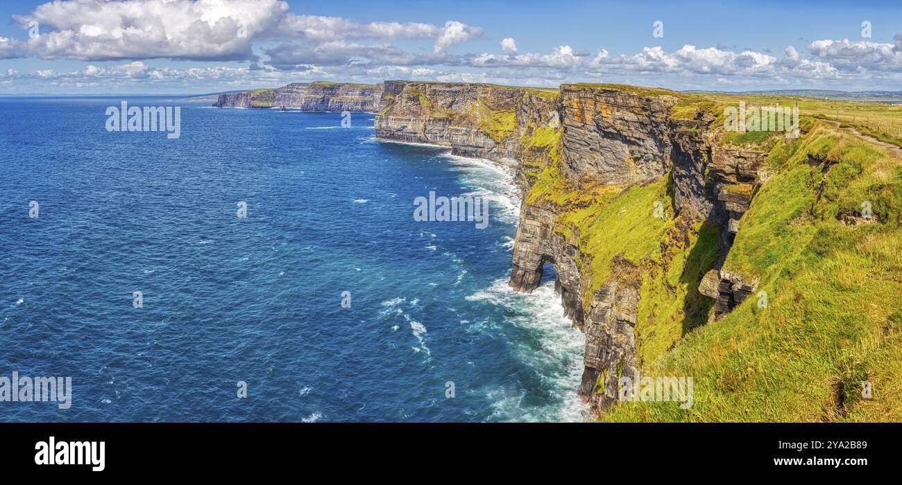 Breathtaking coastal view with green cliffs and deep blue sea under a bright sky, Cliffs of ...