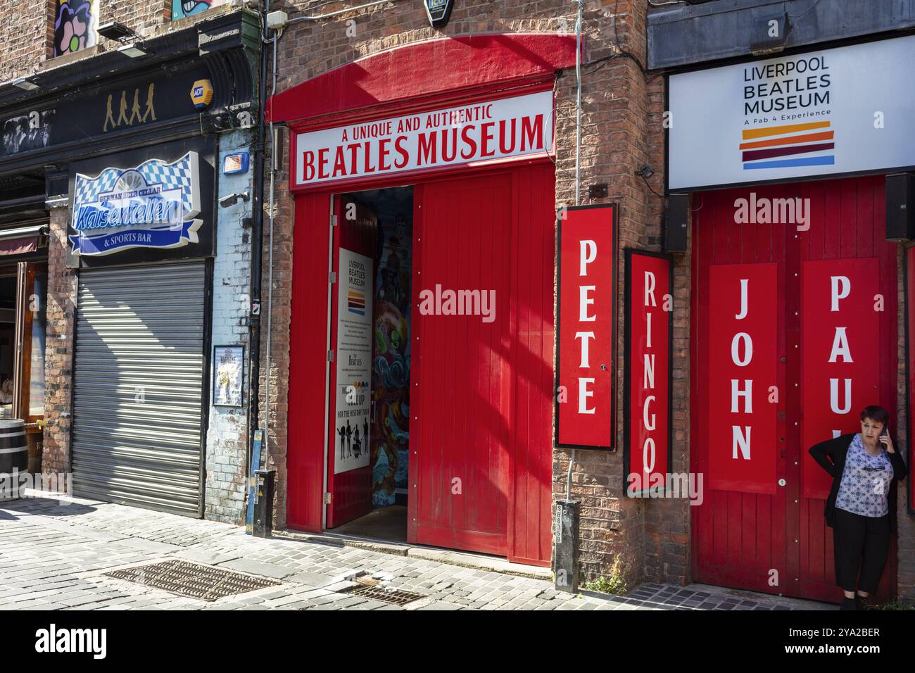 Famous Beatles Museum with distinctive red sign and brick building ...