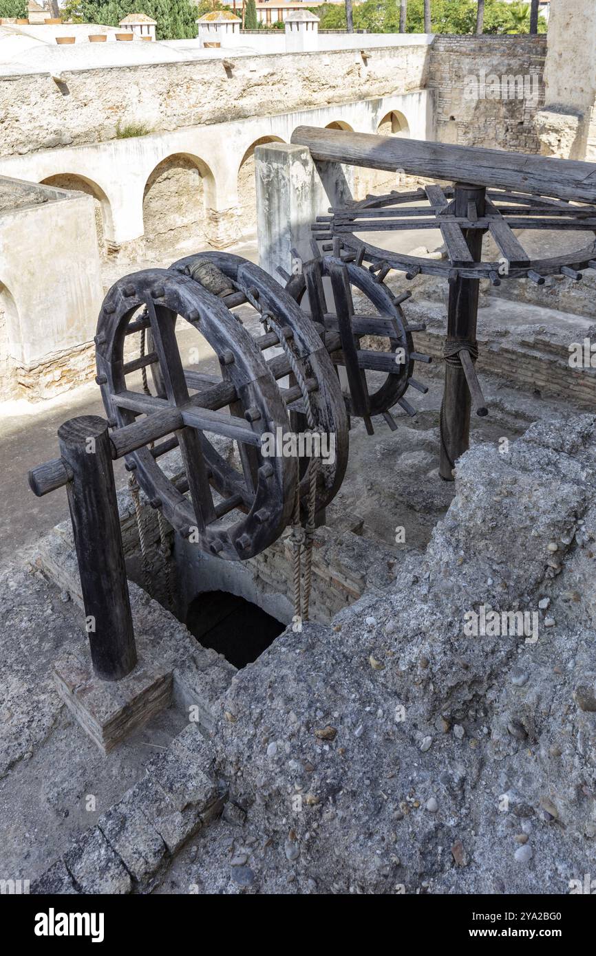 Old wooden machinery with wheels in an antique stone structure, Jerez ...
