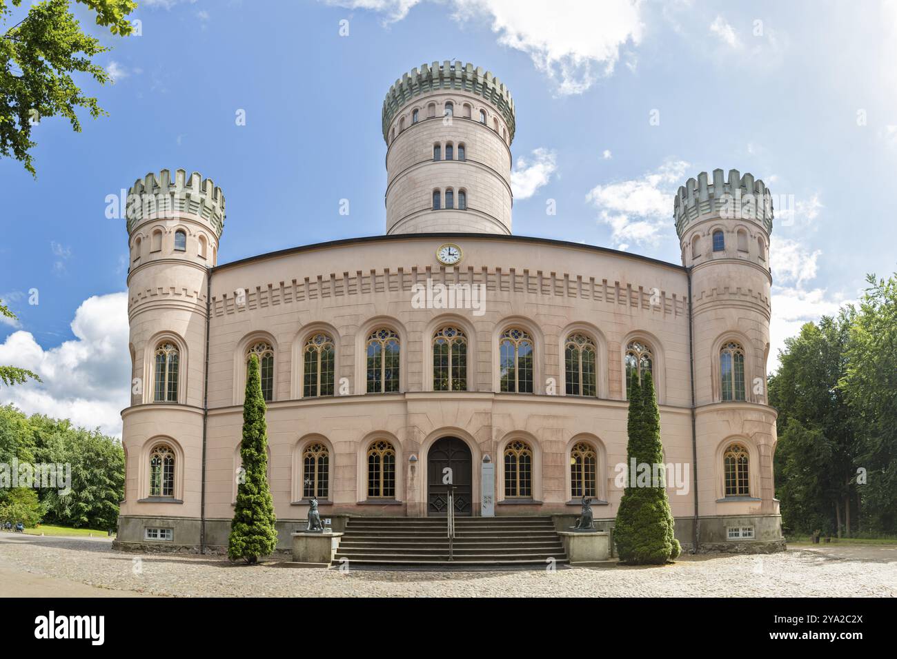 Historic castle with striking towers and decorated windows against a ...
