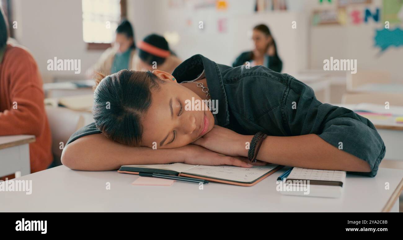 Tired, sleeping and student on desk in classroom at school with fatigue ...