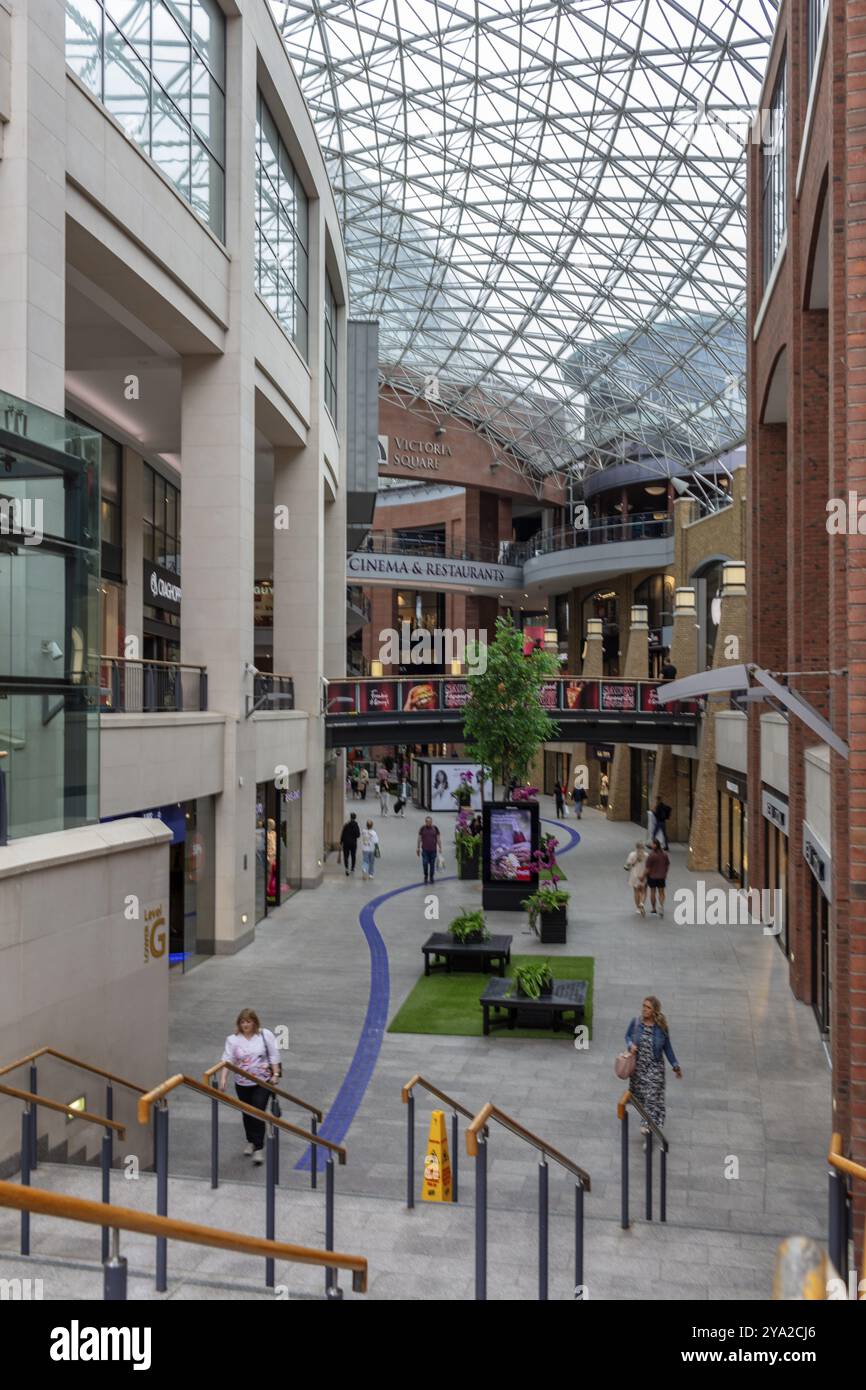 Bright interior of a modern shopping centre with glass ceiling, Belfast ...