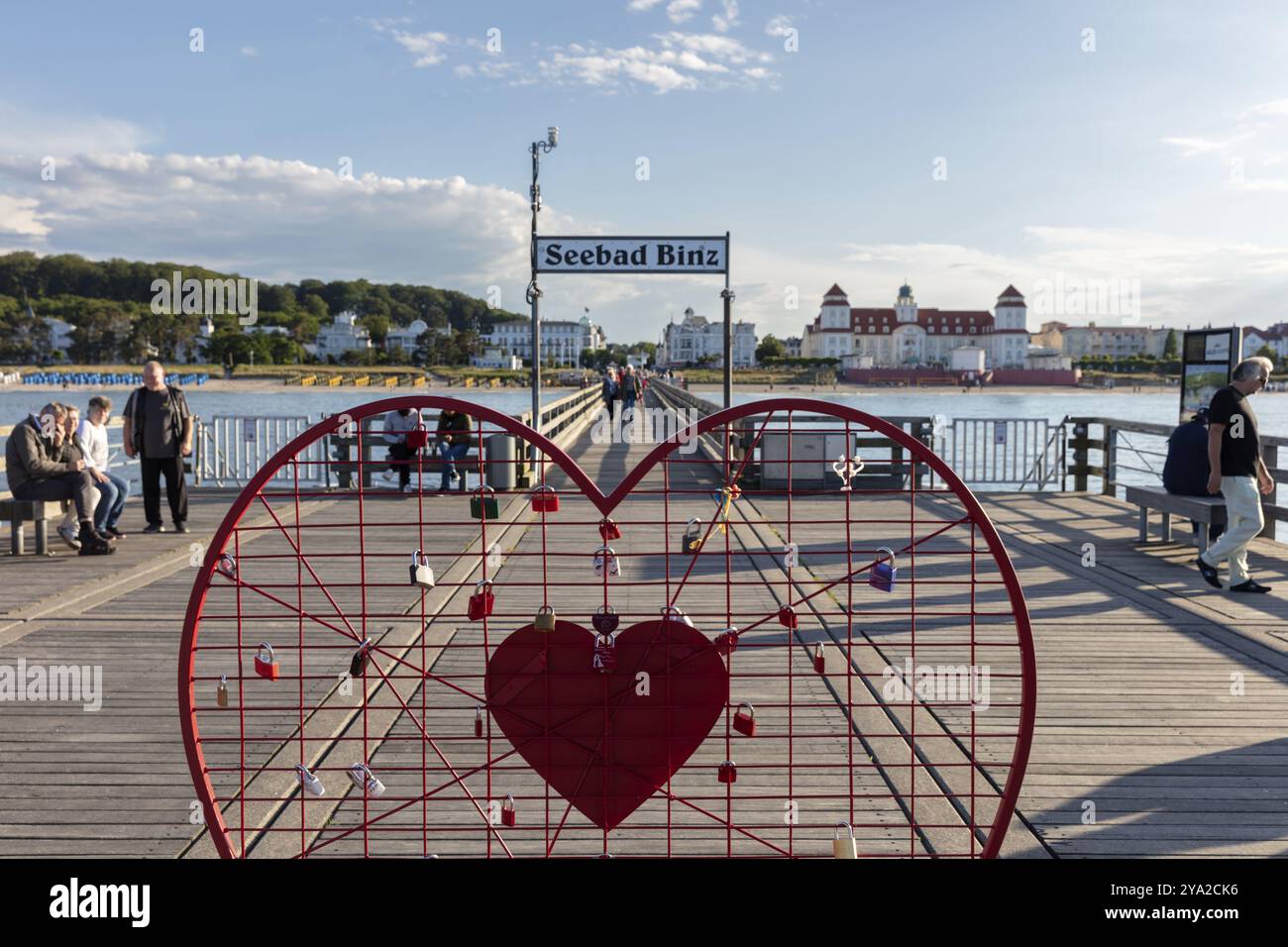 Red heart with castles on a pier with a view of the Seebad Binz ...