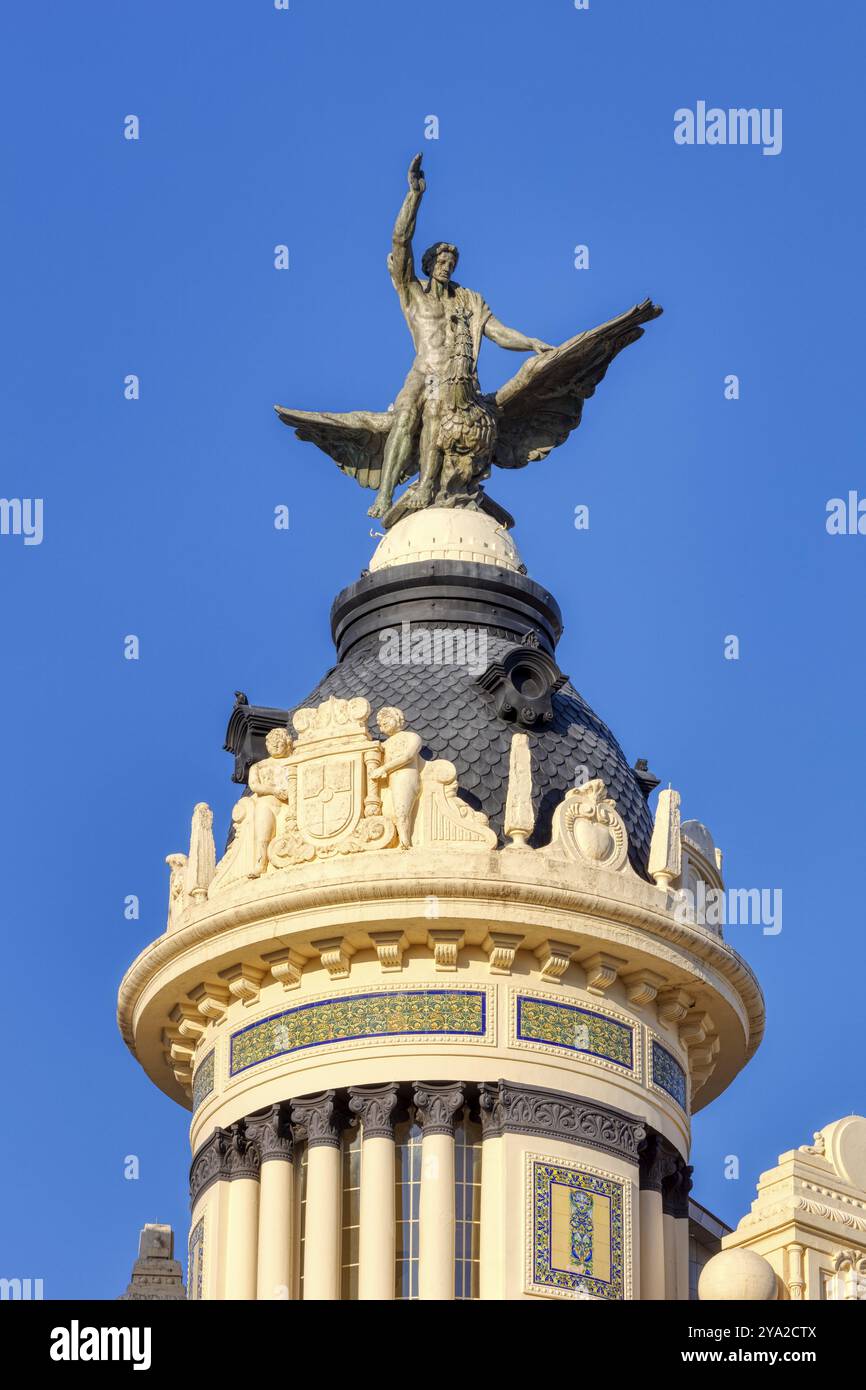 Neoclassical architecture with winged statue on a decorated building ...