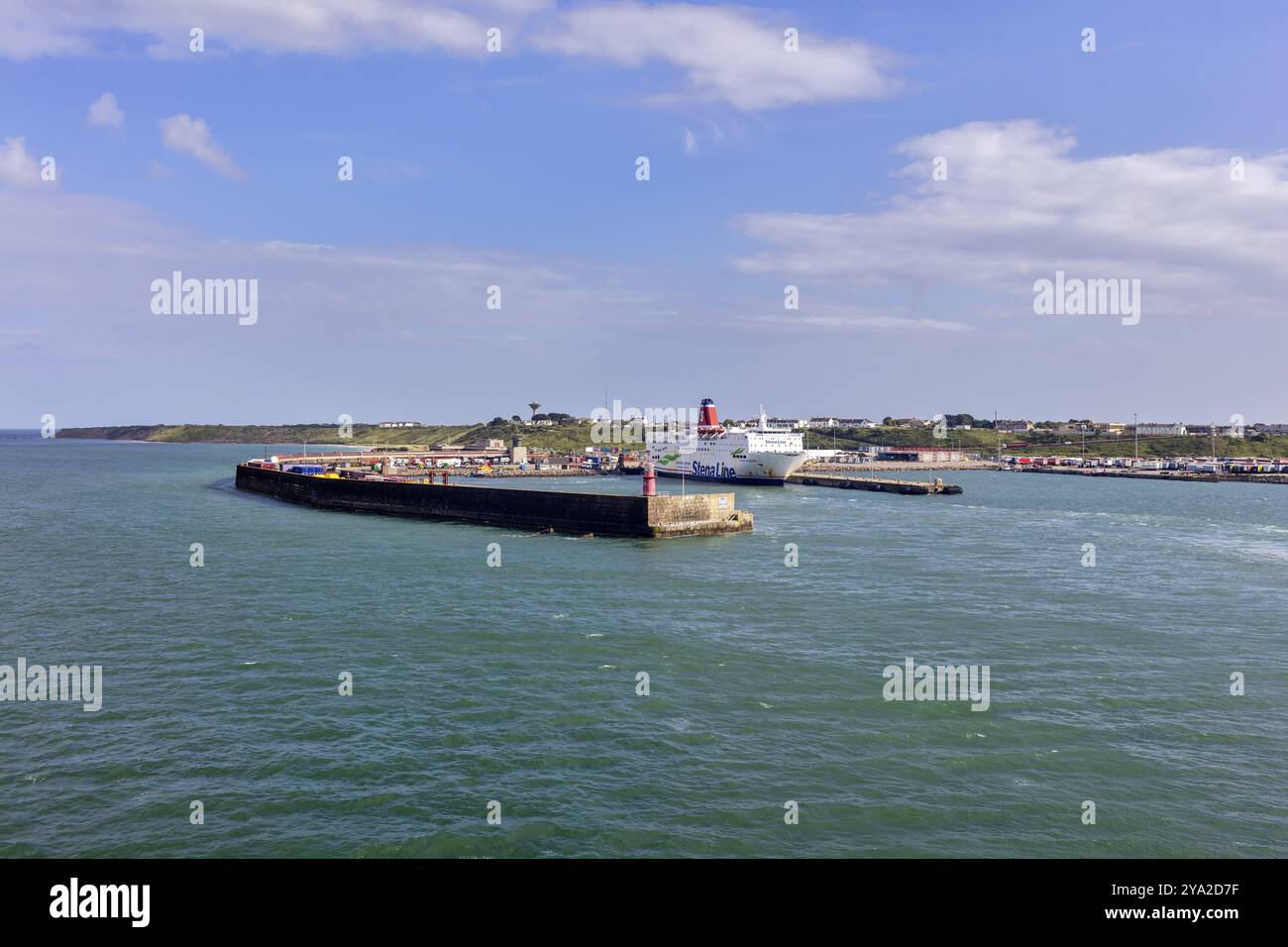 A view of the sea with a distant ferry close to shore under a clear ...