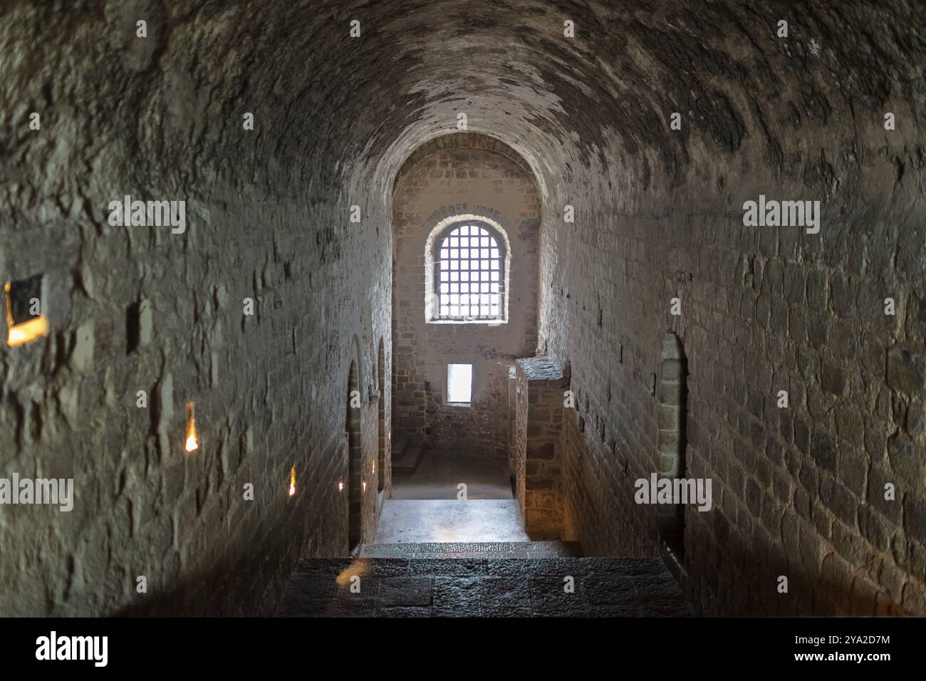 Dark stone corridor with lattice window in medieval style, Le Mont ...
