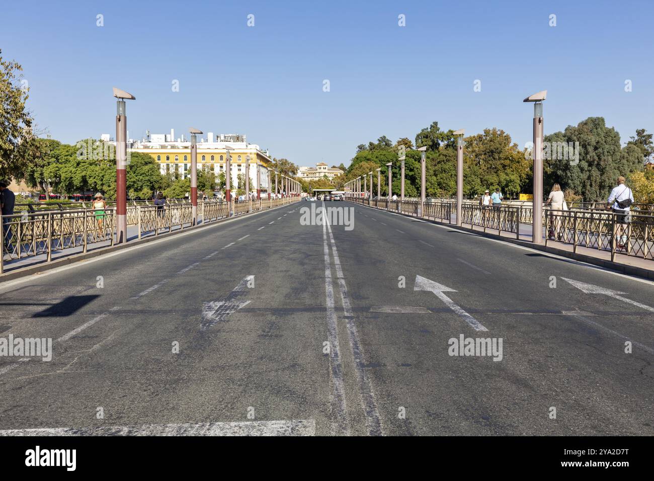 Empty bridge over a wide street with urban background in daylight ...