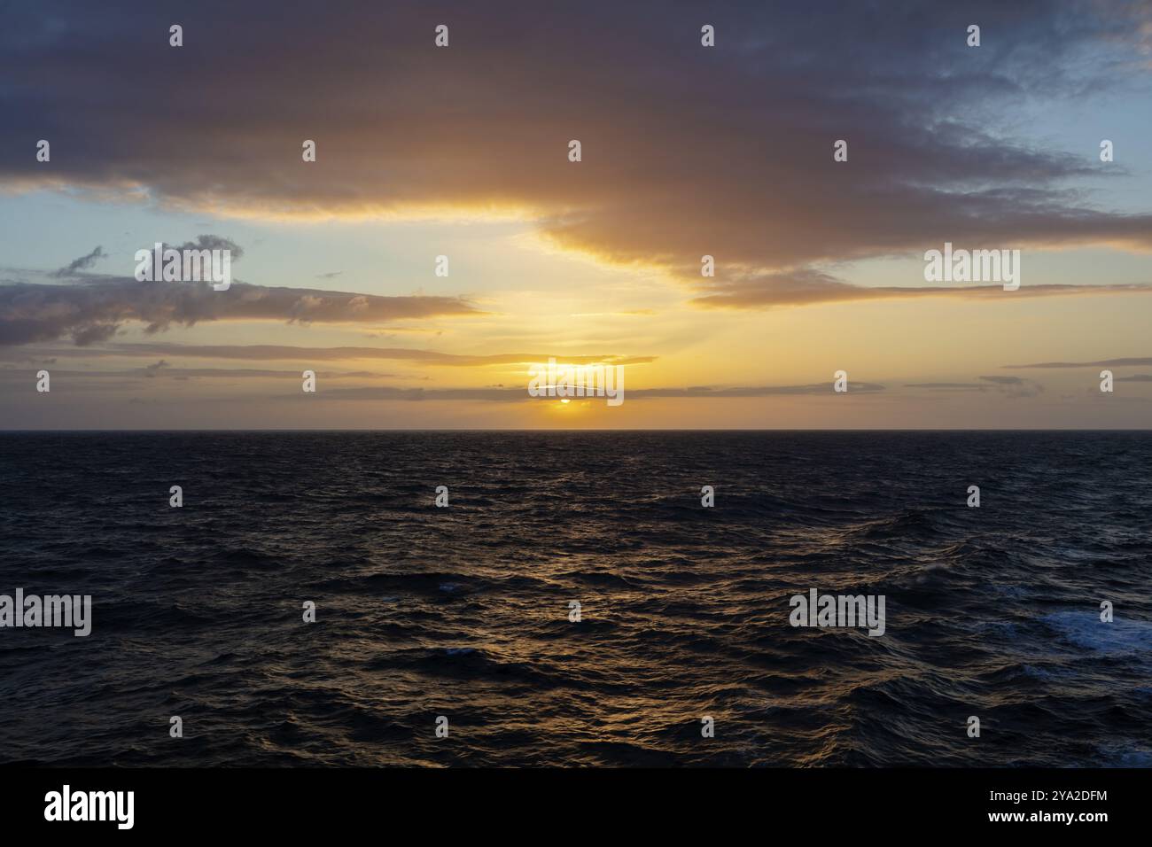 Sunset over the sea with dramatic clouds and a dusky sky, Celtic Sea ...