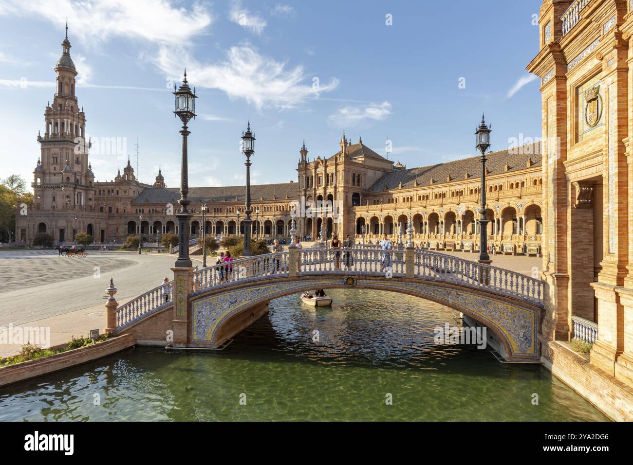 Bridge over a canal in front of an impressive Spanish architectural ...