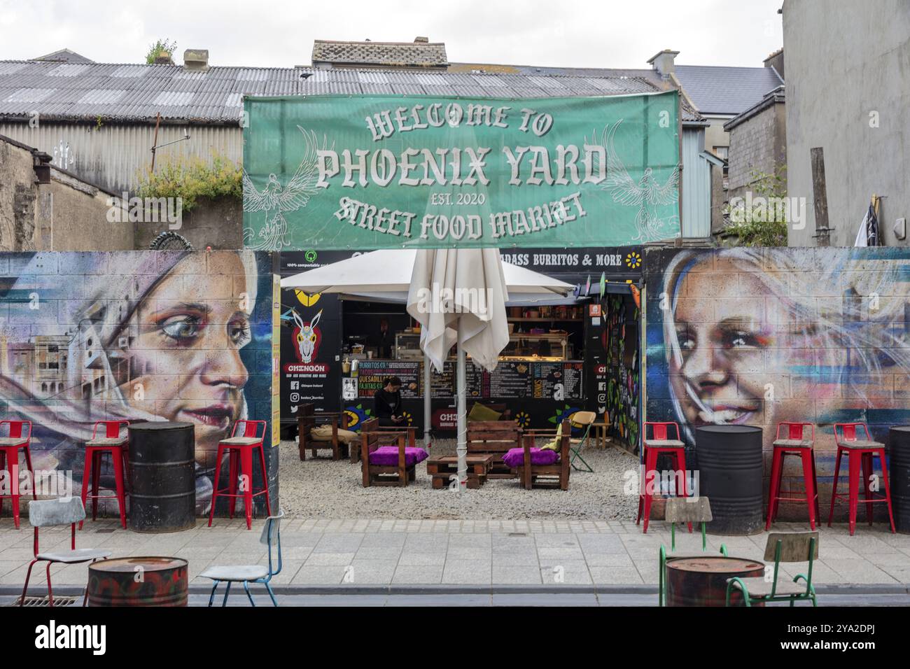 A street food market with lively graffiti and a welcoming atmosphere ...