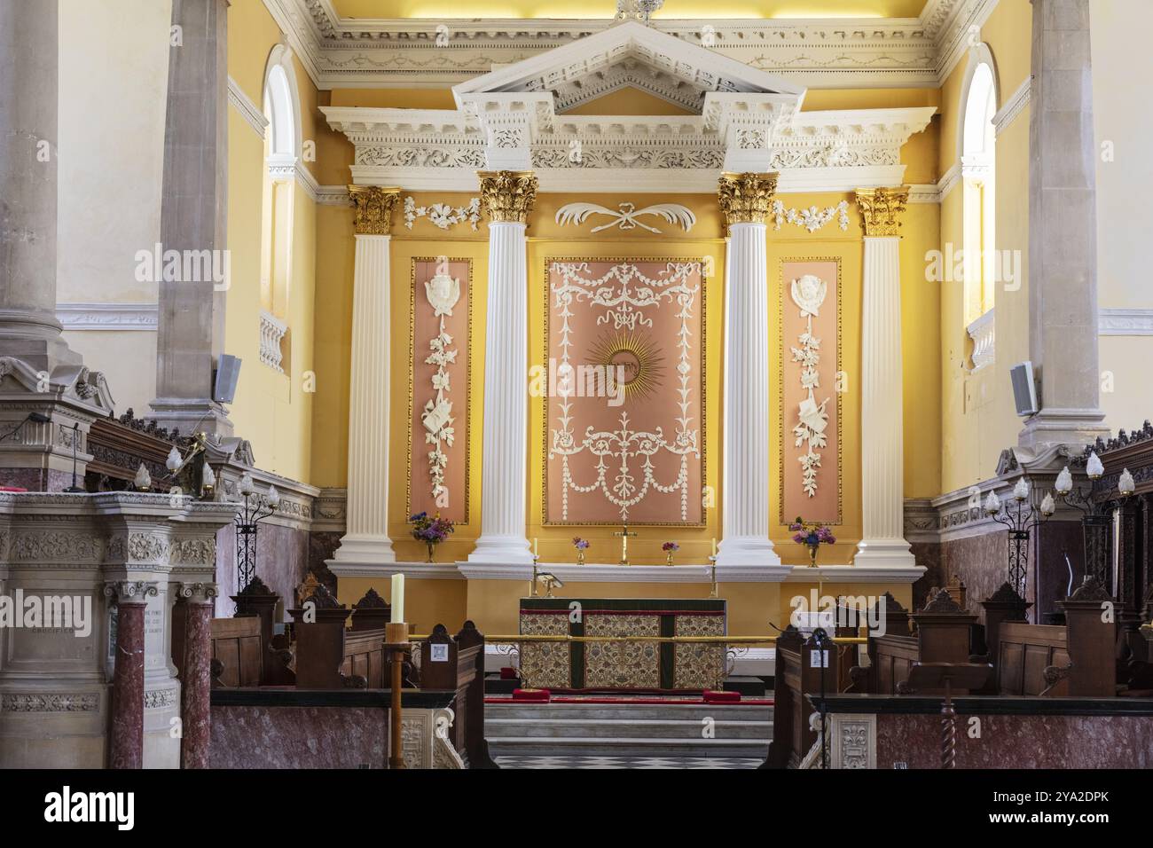 Elegant church interior with decorated altar and pillar details ...