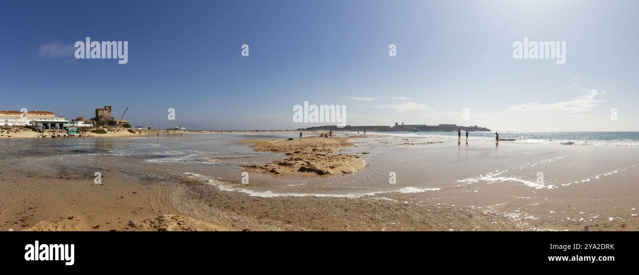 Wide beach panorama with people at the water under a clear sky, Tarifa ...