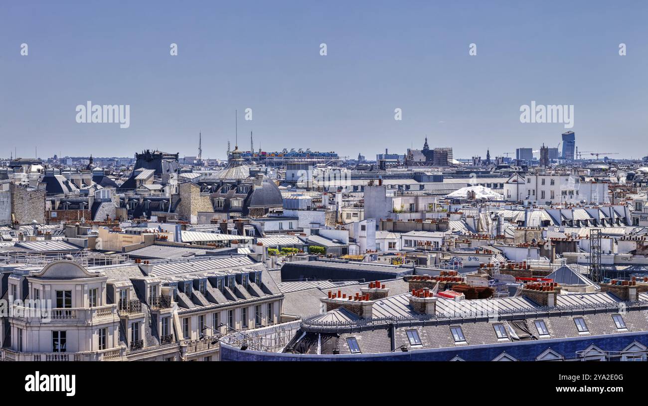 Panorama of the rooftops of Paris under a clear sky, Paris Stock Photo ...