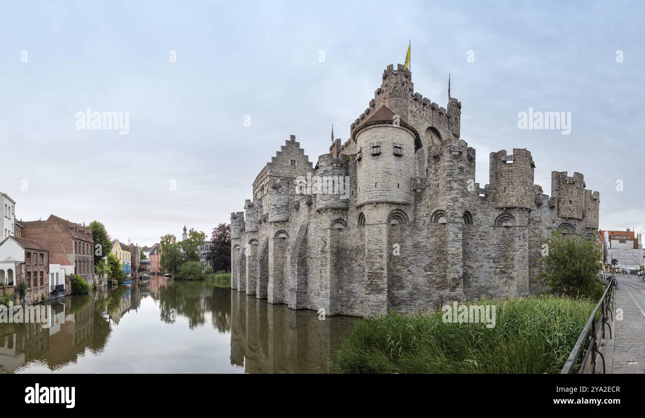Imposing medieval castle with moat in a peaceful neighbourhood, Ghent ...