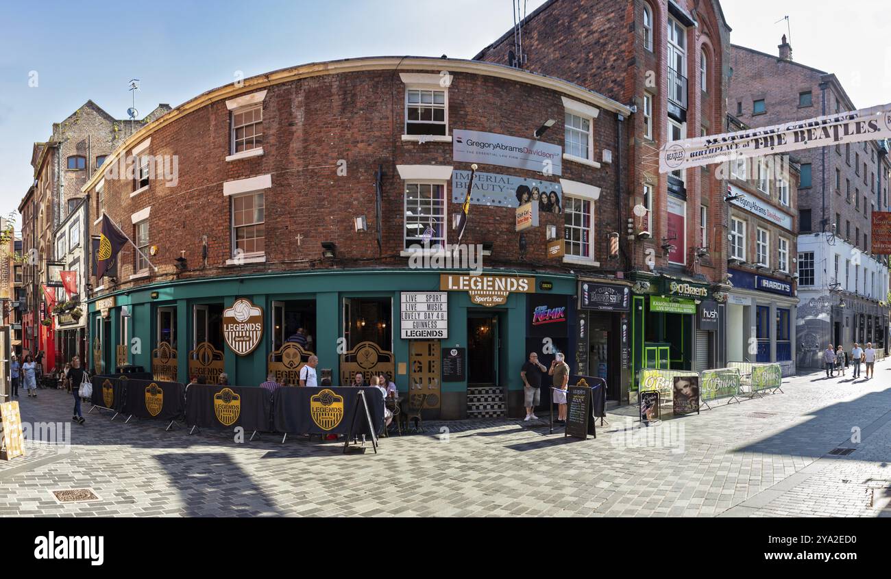 Historic corner building in a busy street with references to Beatles ...