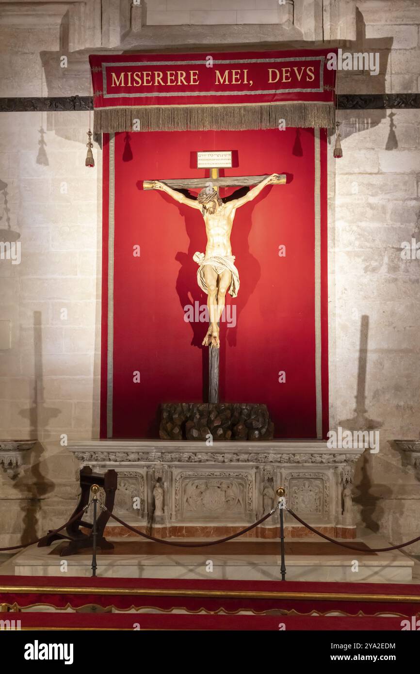 Altar with a red background and a crucifixion depiction of Jesus Christ ...