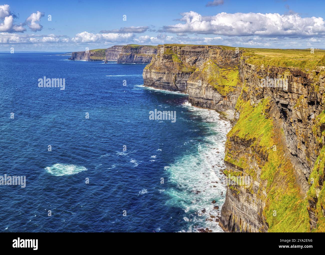 Dramatic cliff landscape with impressive coastline and deep blue water ...