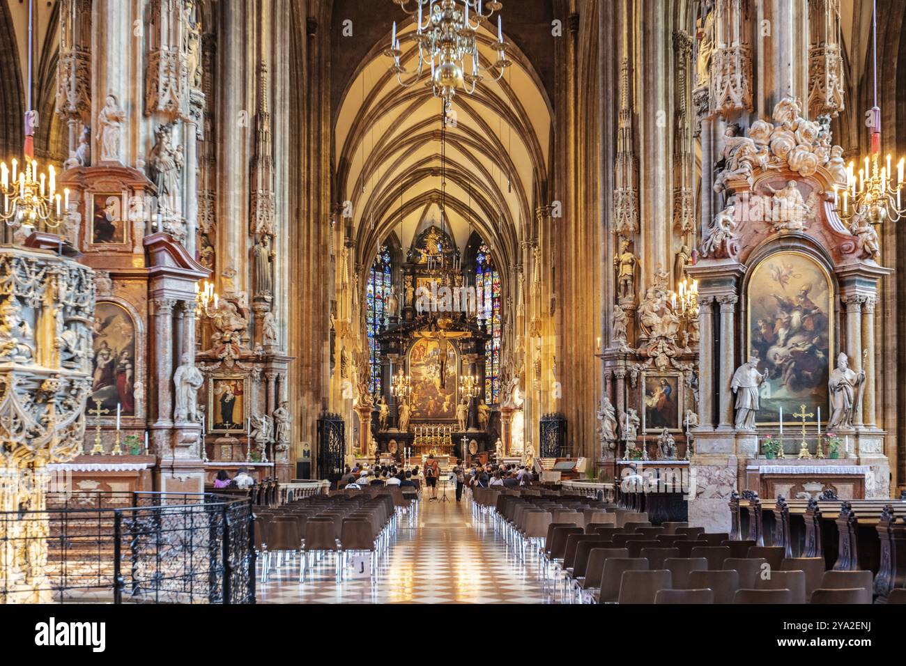 Elaborate interior of a Gothic church with high vaults and rich ...