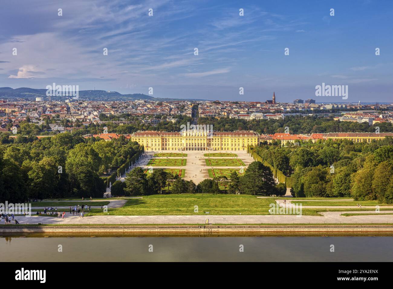 Expansive view from above of a castle and its gardens, surrounded by ...