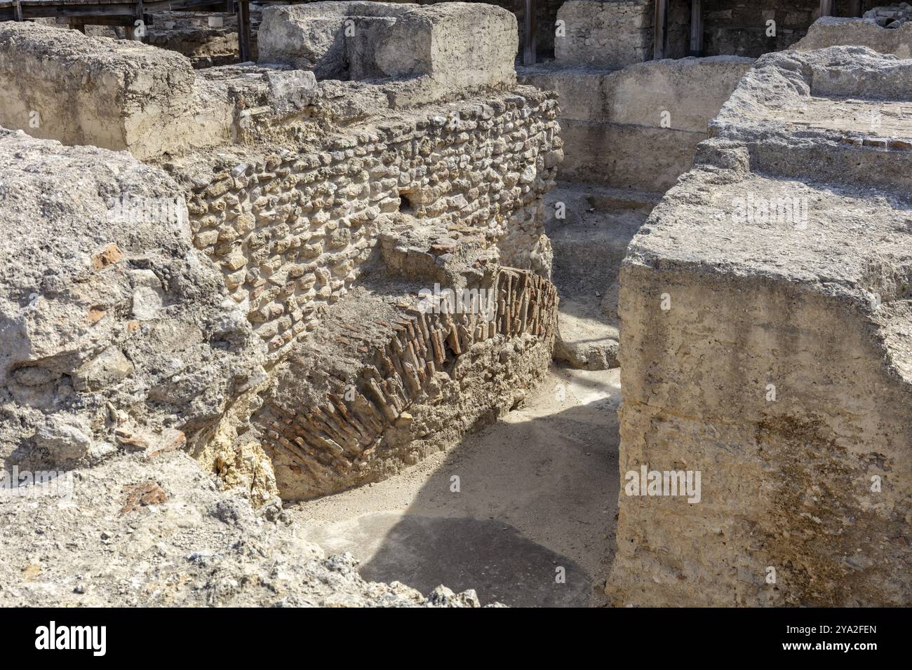 Approaching archaeological ruins with ancient sandstone walls, Jerez ...