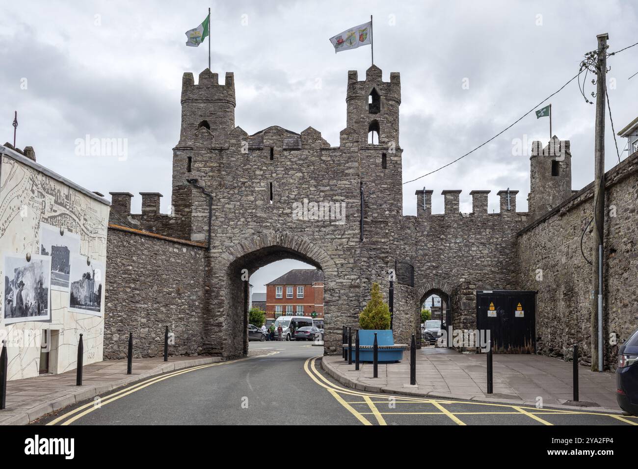 Stone gate structure with towers and flags, historic ambience, Macroom ...