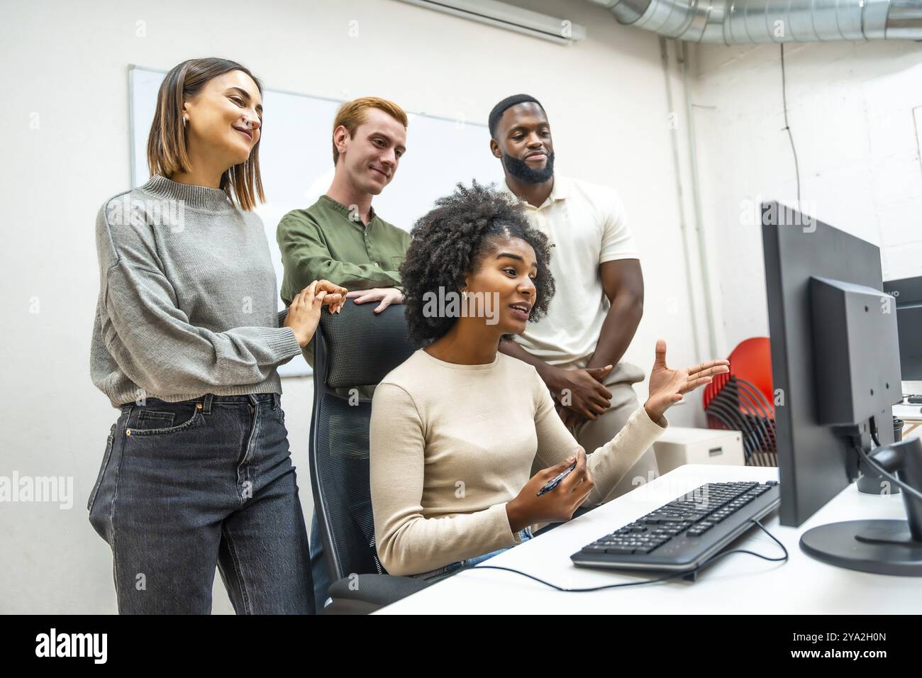 Diverse members of a coworking talking during online meeting together ...